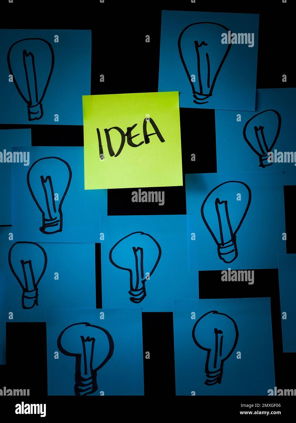 Concept of lighbulbs with an illuminated lightbulb to indicate ...