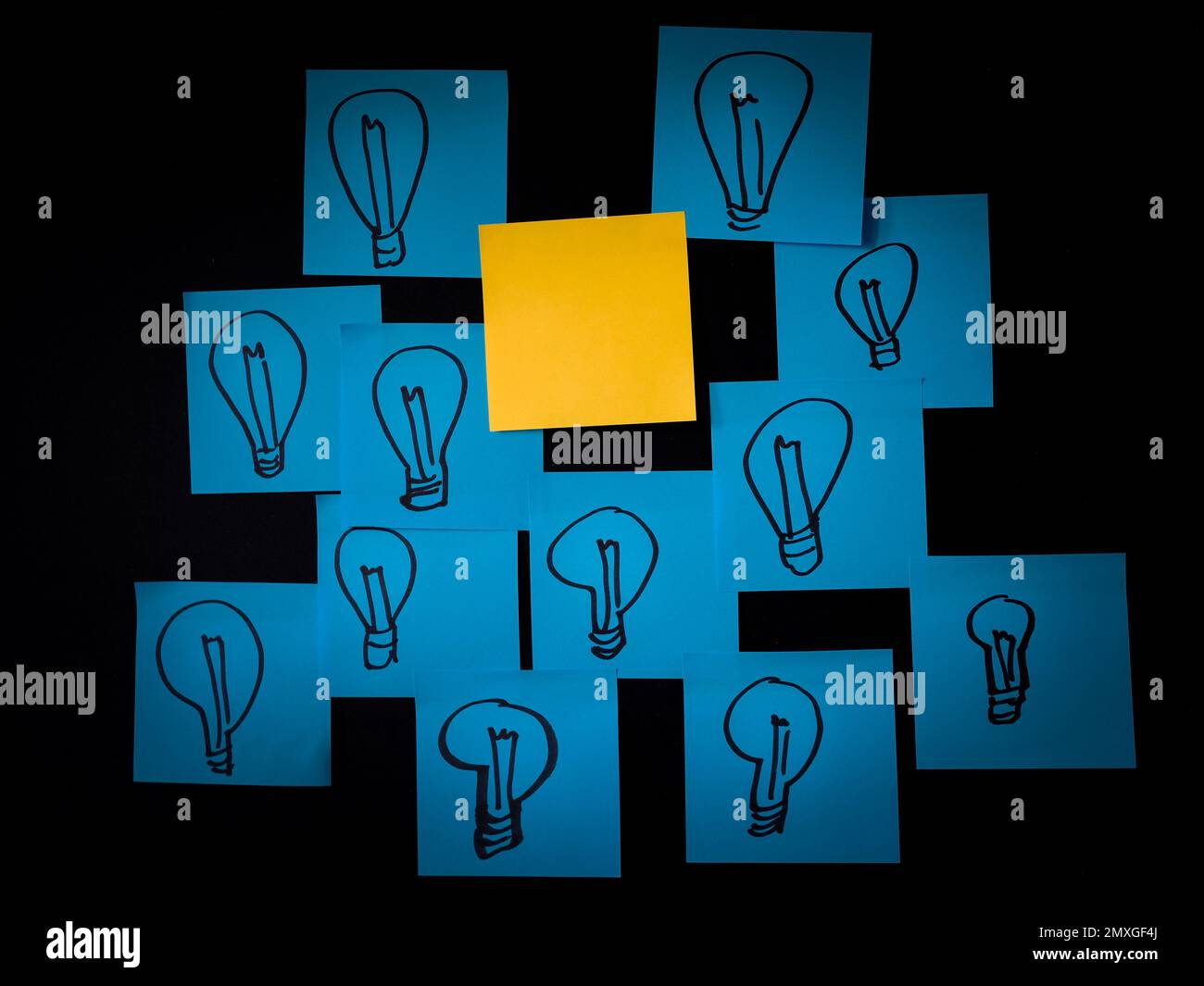 Concept of lighbulbs with an illuminated lightbulb to indicate ...
