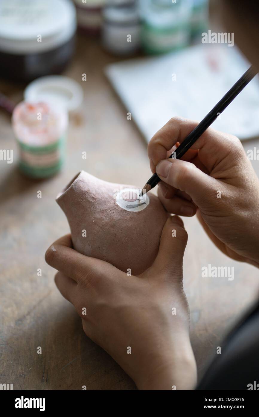 Craftsmaster makes interesting sketch drawing symbol on pitcher using ...