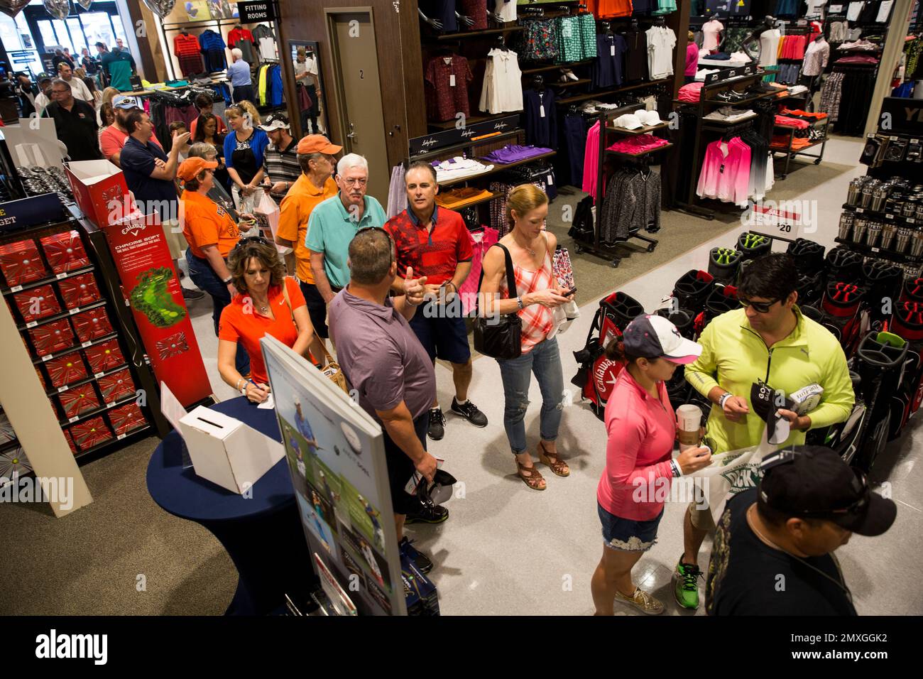 Fans wait in line to meet golf commentator David Feherty at the new ...