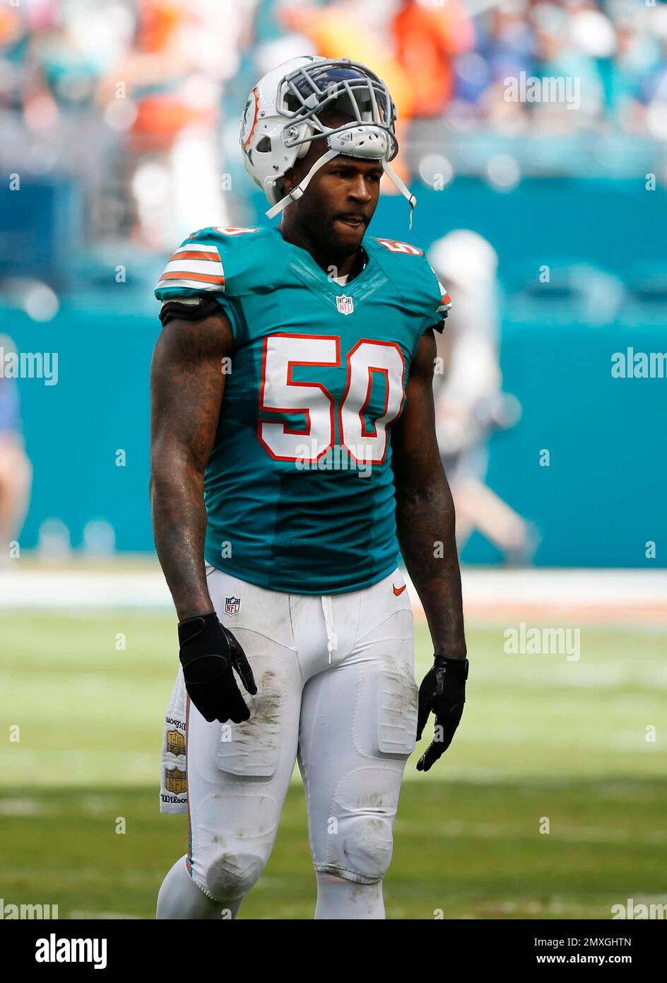 Miami Dolphins defensive end Andre Branch (50) walks off the field ...