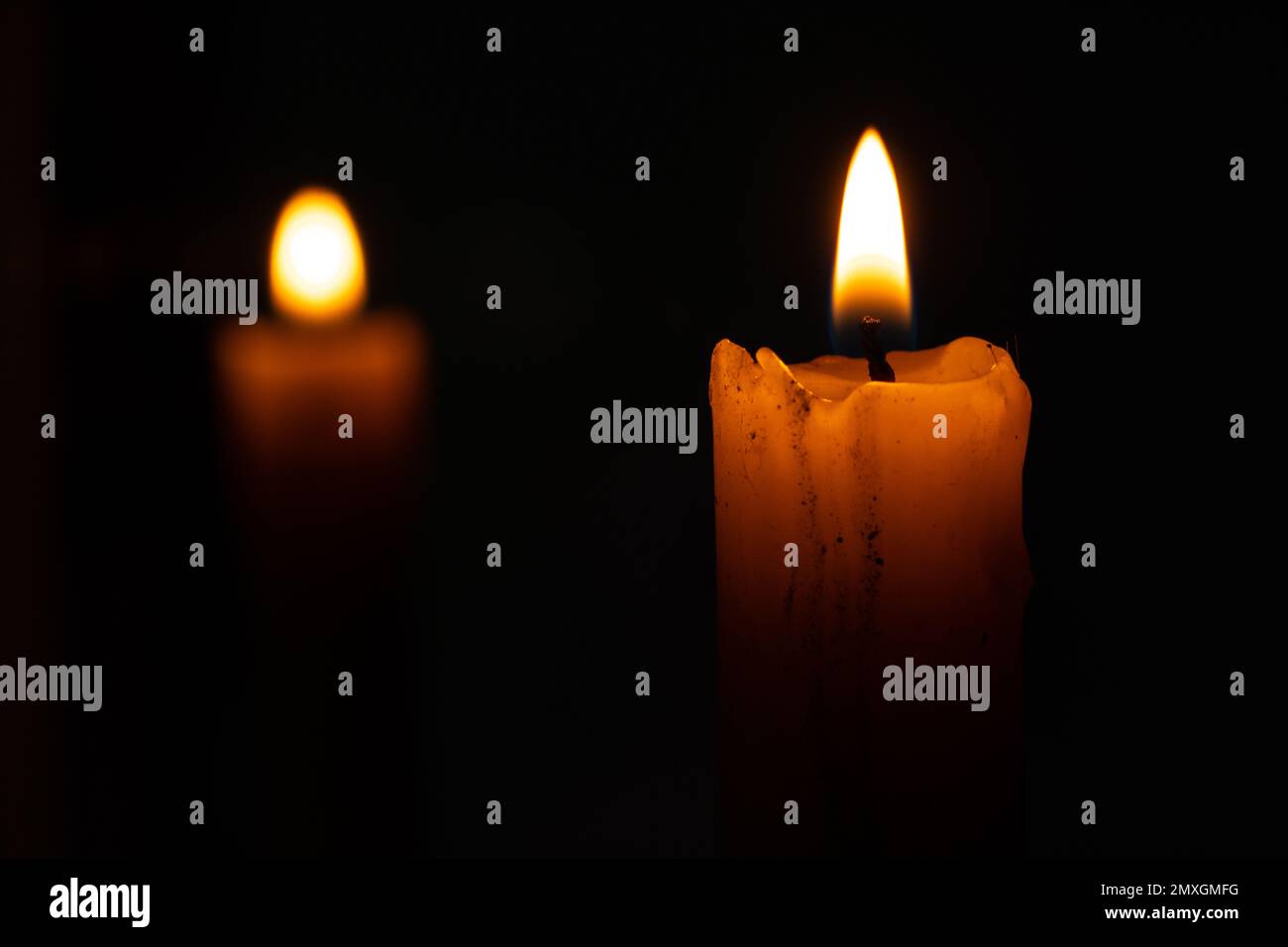 candle fire and back reflection of a candle in a mirror Stock Photo - Alamy