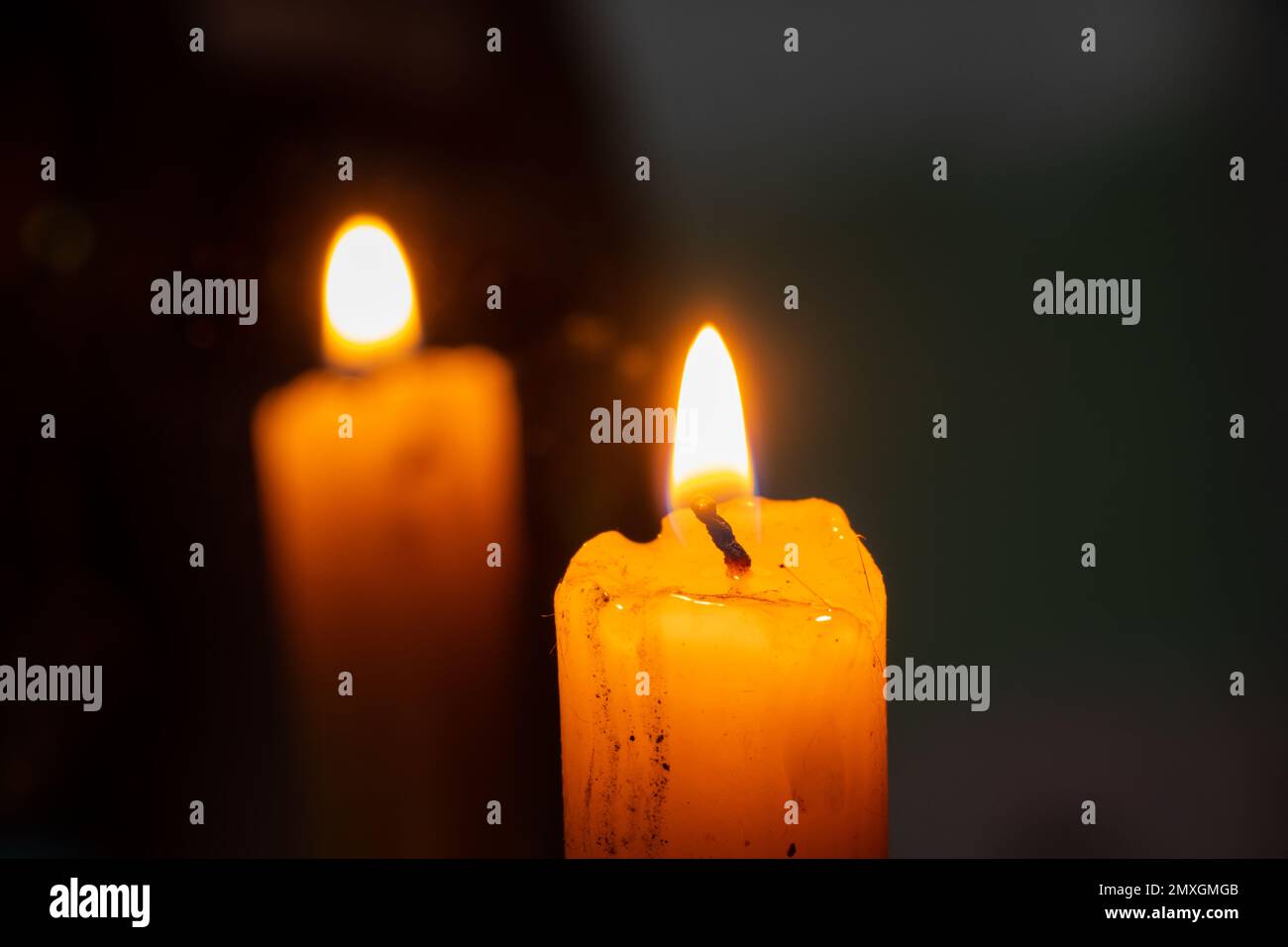 candle fire and back reflection of a candle in a mirror Stock Photo - Alamy
