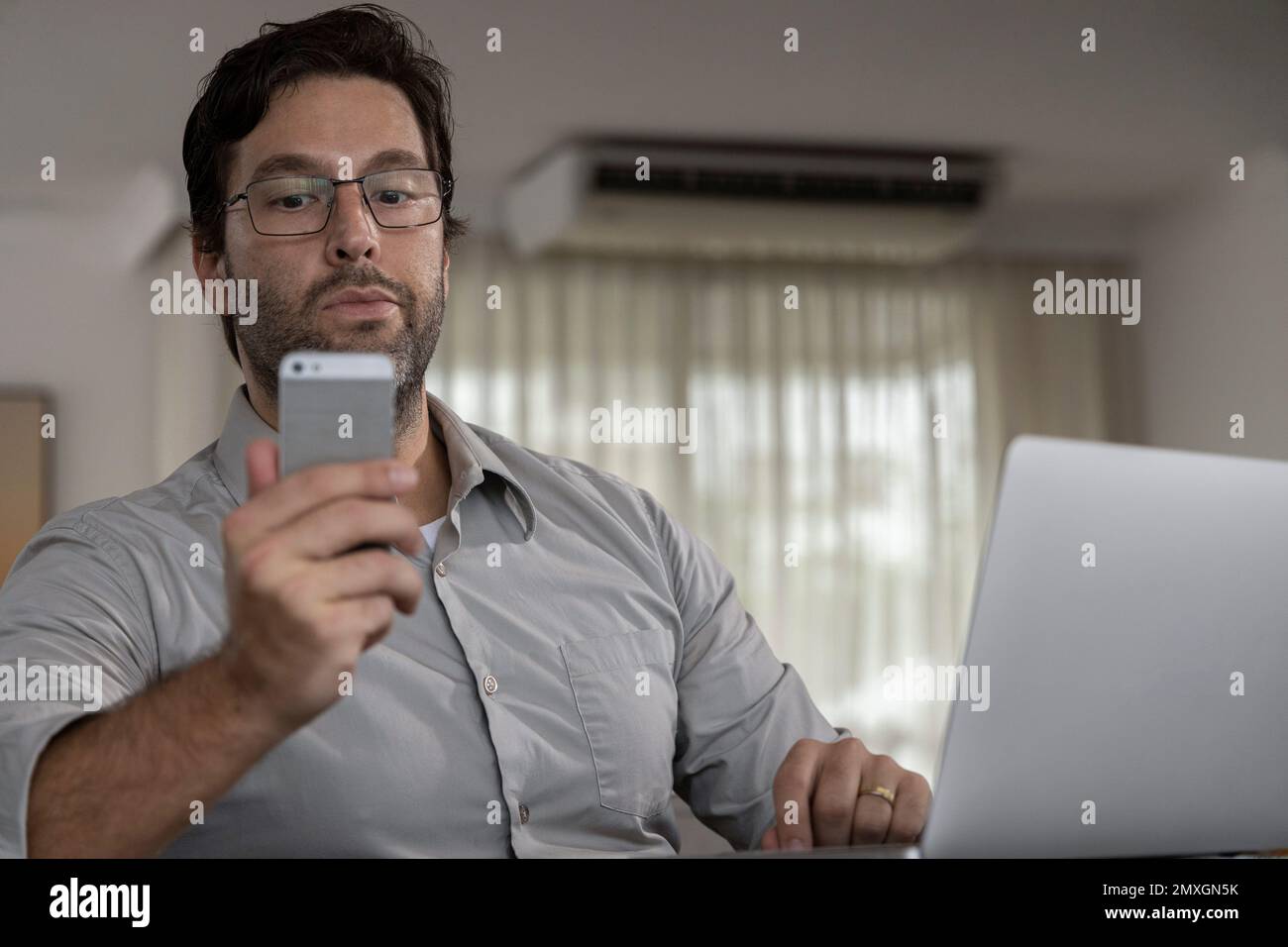 Distracted during work meeting hi-res stock photography and images - Alamy