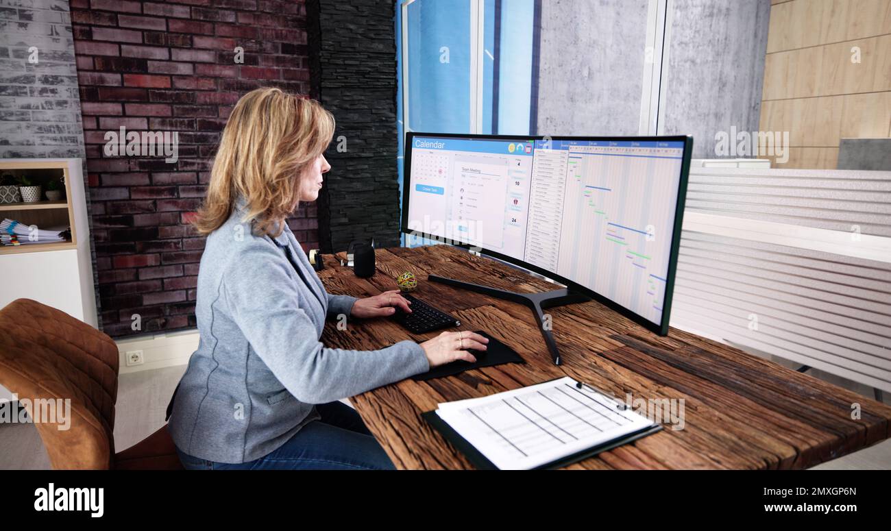Woman Working On Calendar Agenda Schedule On Computer Stock Photo - Alamy