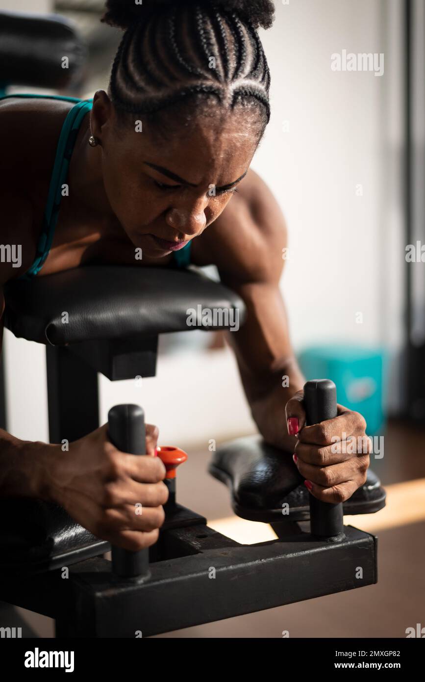 Beautiful woman training leg muscles. Bodybuilding exercises Stock ...