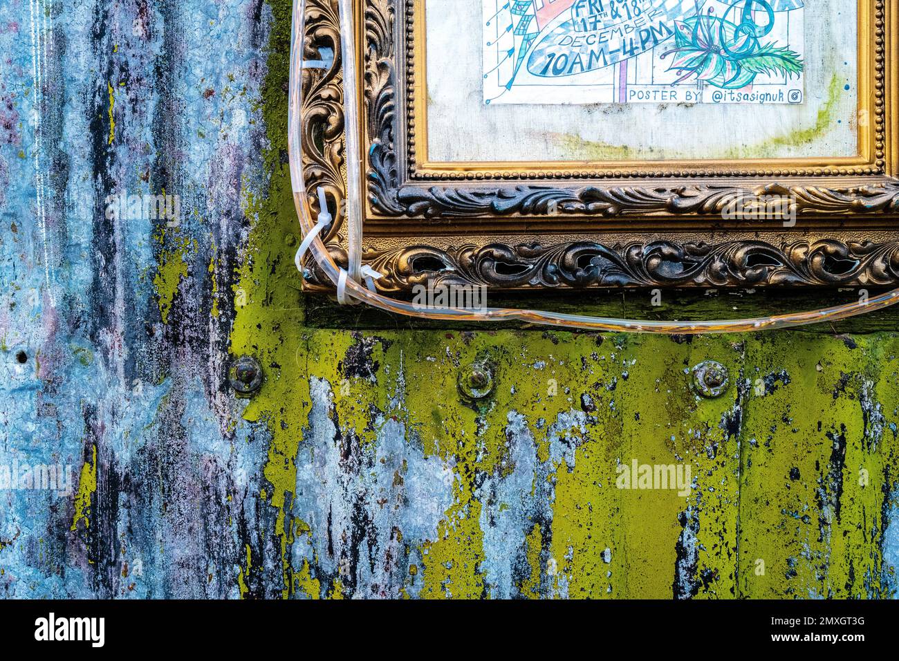 Rusted green painted and grey wall of an old corrugated metal shed in ...