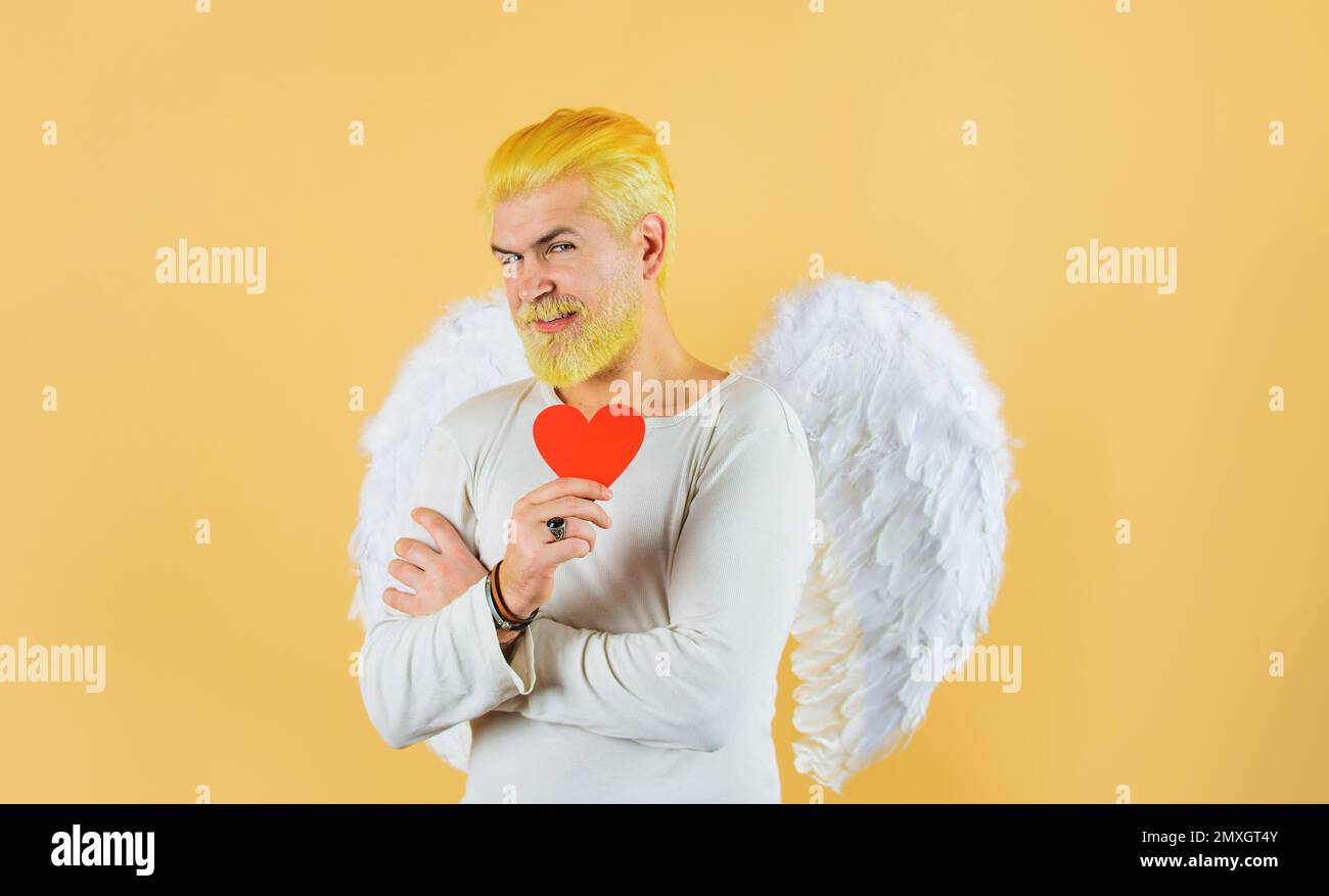 Happy Valentines Day. Cupid with red paper heart. Bearded man in angel ...
