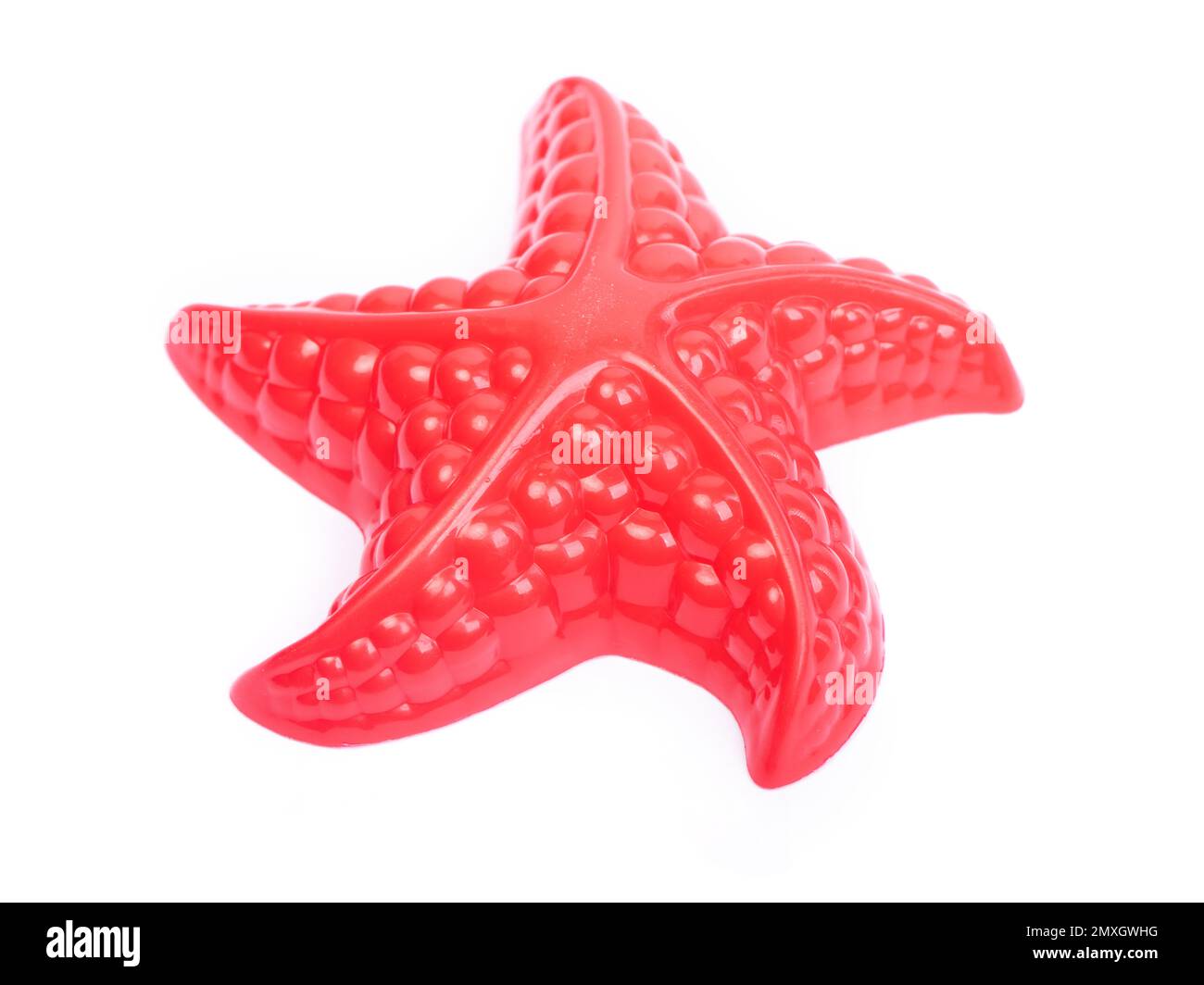 Red plastic starfish isolated on white background Stock Photo - Alamy