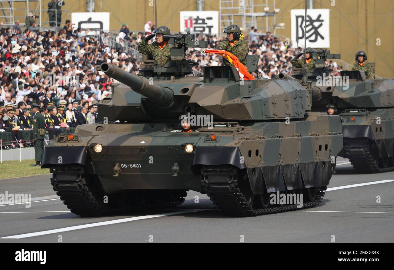 Members of the Japan Ground Self-Defense Force salute from Type 10 ...