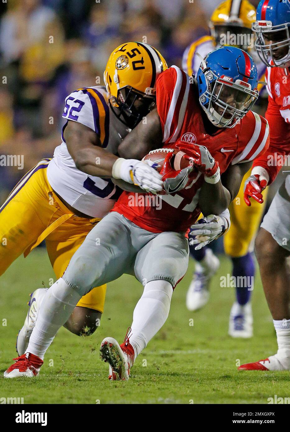 LSU linebacker Kendell Beckwith (52) tackles Mississippi running back ...