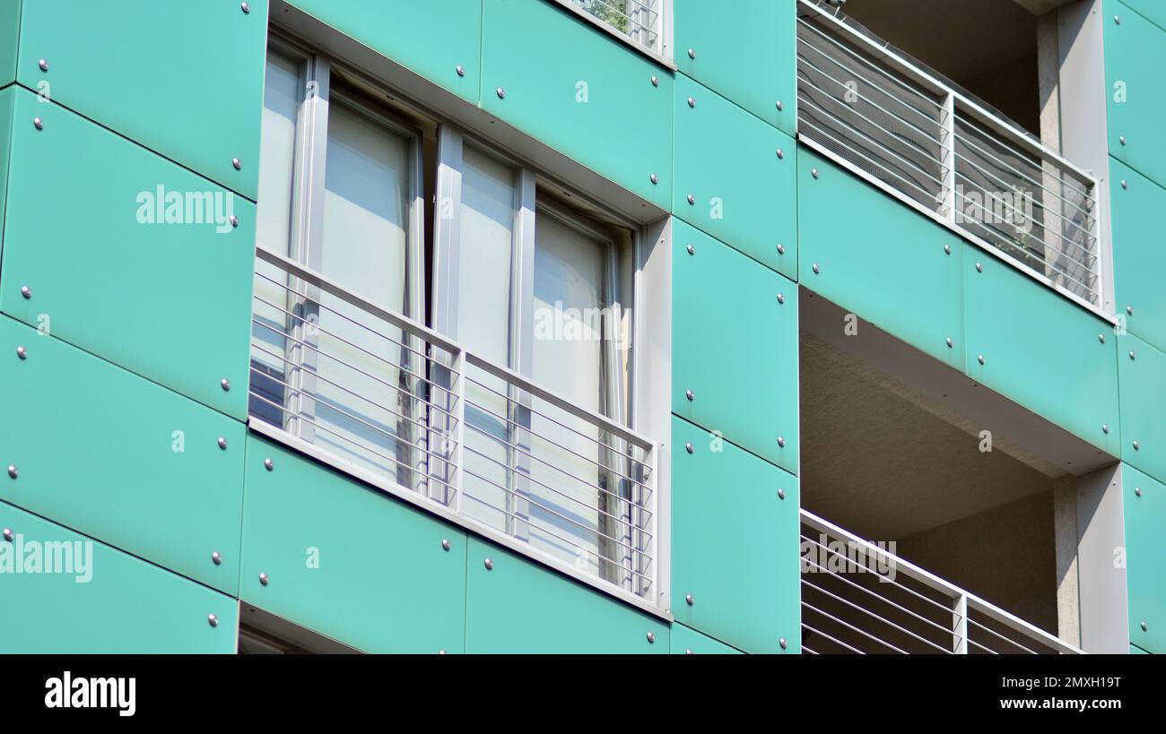 Modern apartment buildings on a sunny day with a blue sky. Facade of a modern apartment building ...