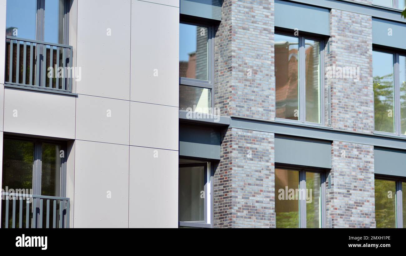 Modern apartment buildings on a sunny day with a blue sky. Facade of a ...