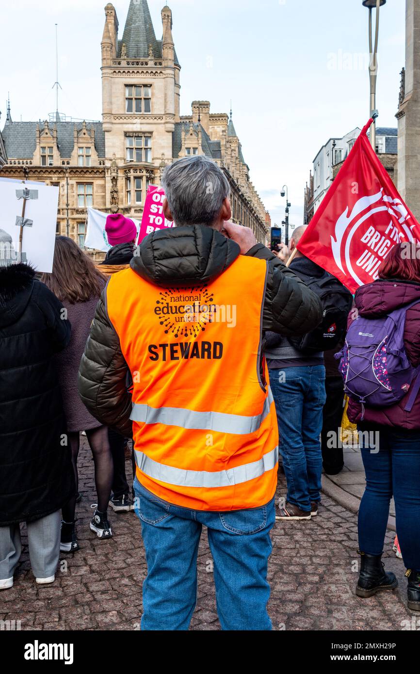 A steward at a protest march in Cambridge, UK, in support of the ...