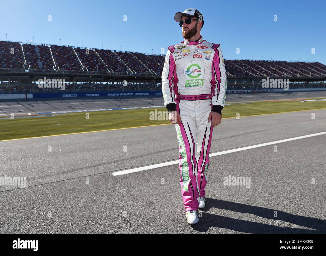 Austin Dillon walks on pit road before qualifying for Sunday's NASCAR ...