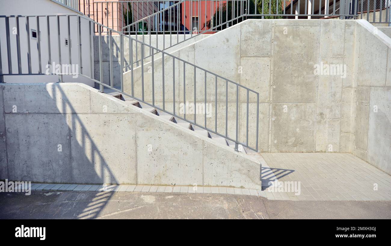 Modern concrete stairs and metal railings outside Stock Photo - Alamy