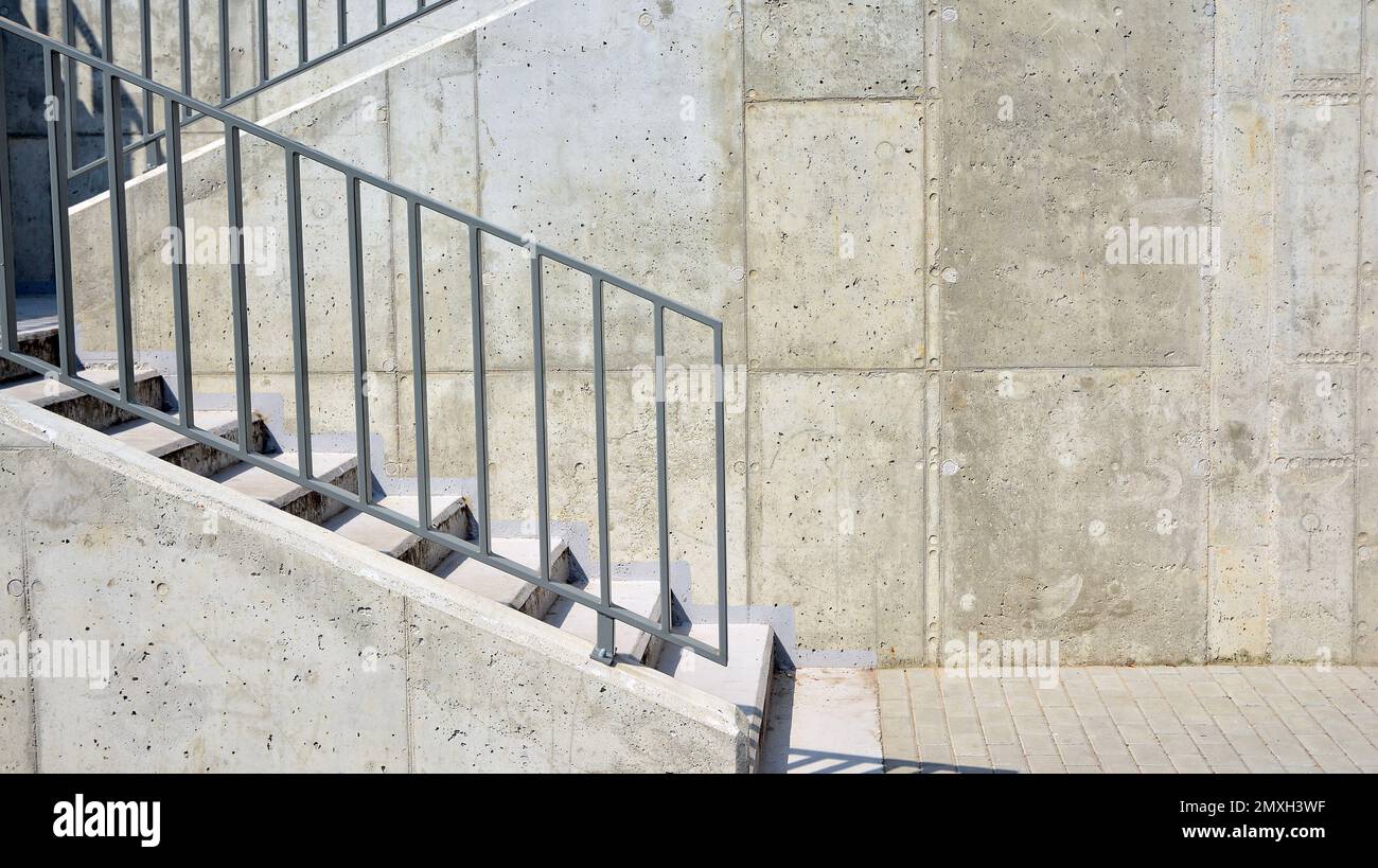 Modern concrete stairs and metal railings outside Stock Photo - Alamy