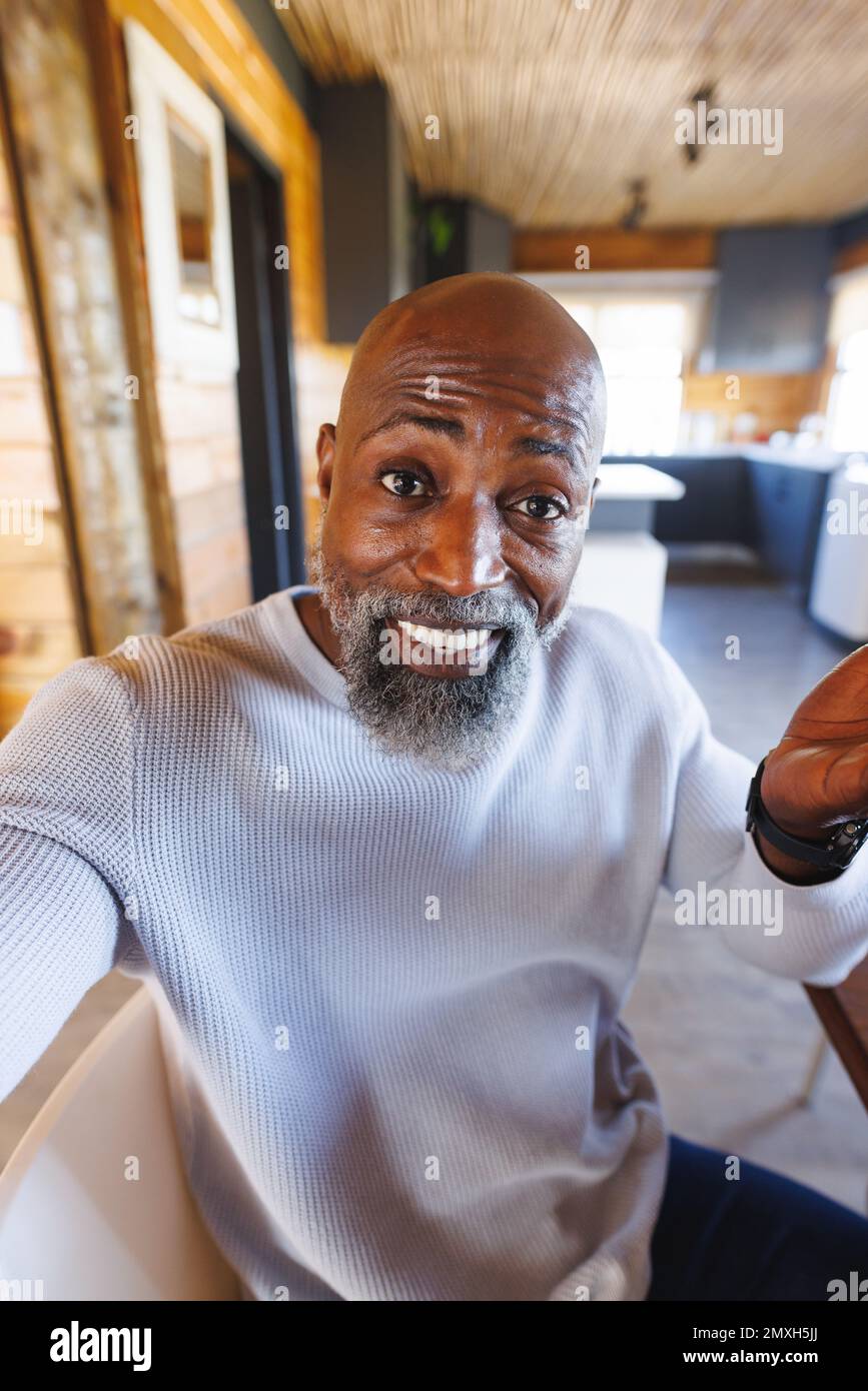 Close-up of african american bald confused senior man shrugging his ...