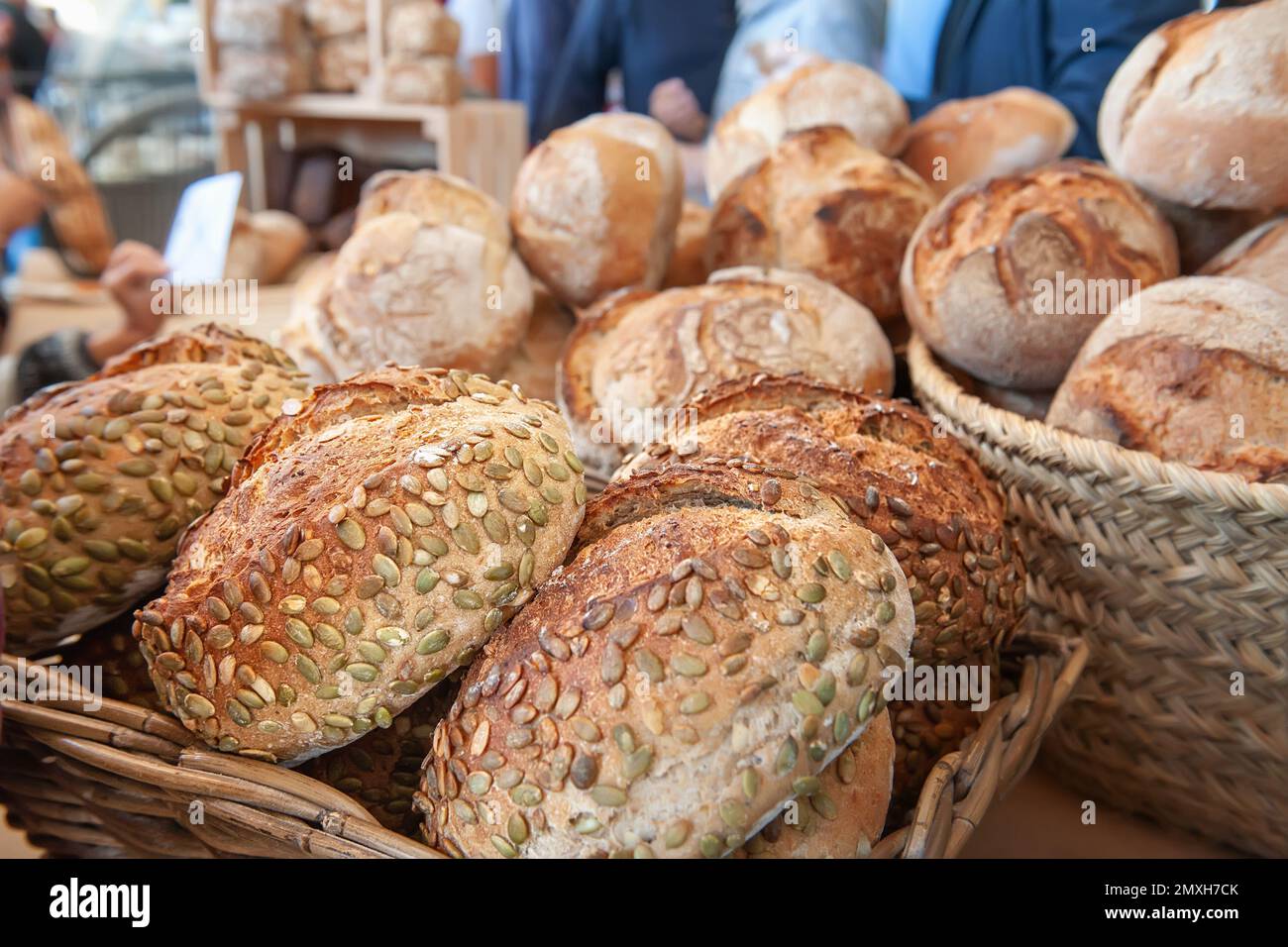 Rye sourdough bread with sunflower seeds on the counter. Bulging round ...