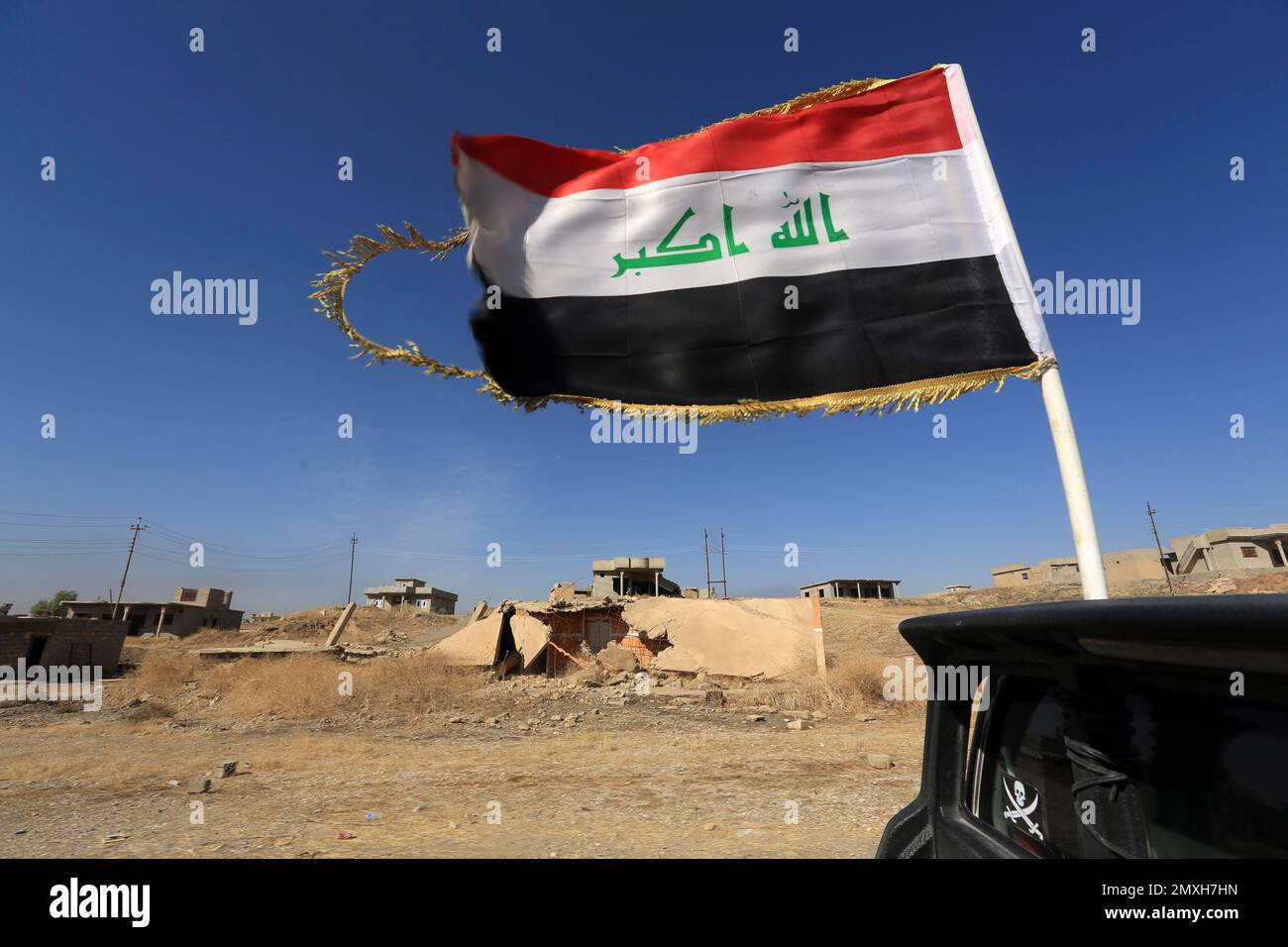 Iraqi security forces are deployed in Bartella, Iraq, Friday, Oct. 21 ...