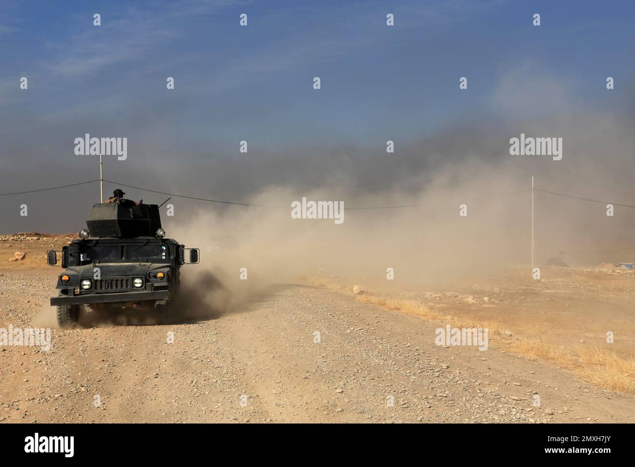 Iraqi security forces advance outside Bartella, Iraq, Friday, Oct. 21 ...