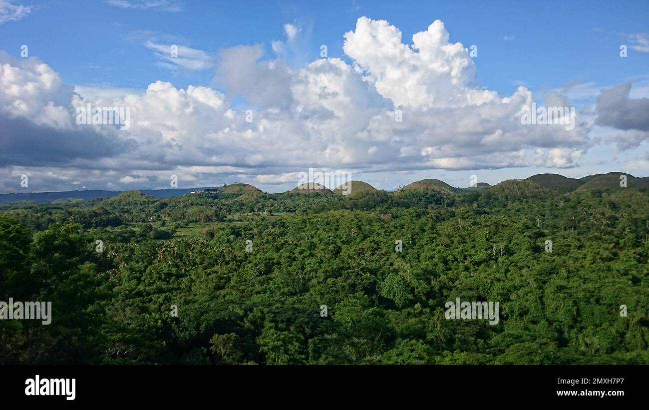 A landscape view of the Bohol island with Chocolate Hills in background ...