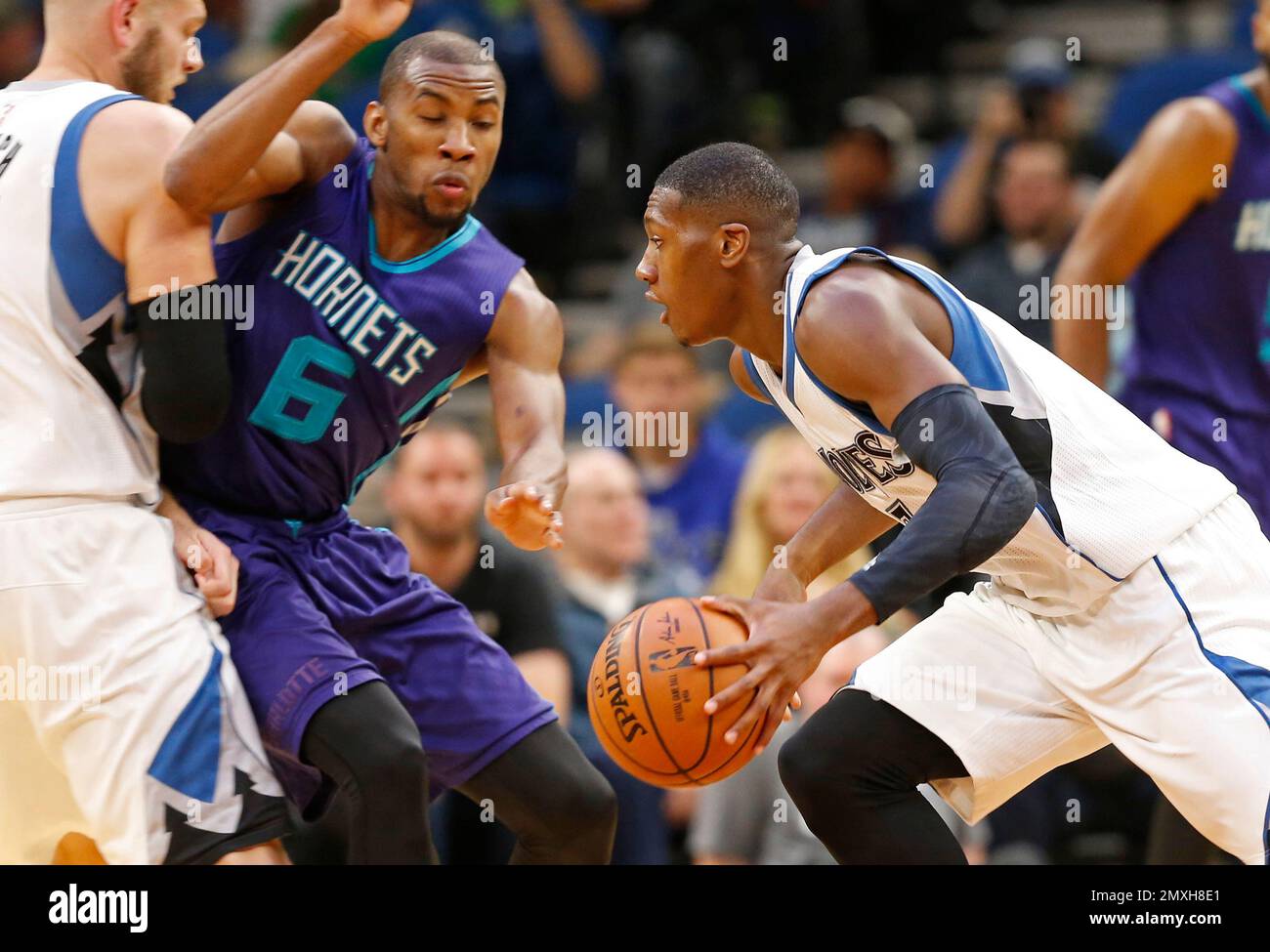 Minnesota Timberwolves' Kris Dunn, right, drives as Nemanja Bjelica ...