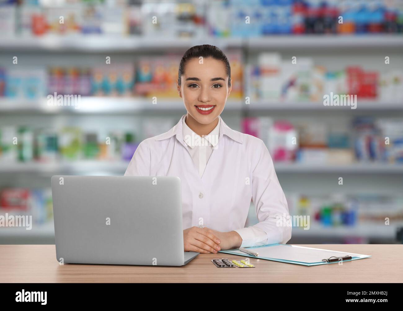 Blurred view female pharmacist hi-res stock photography and images - Alamy