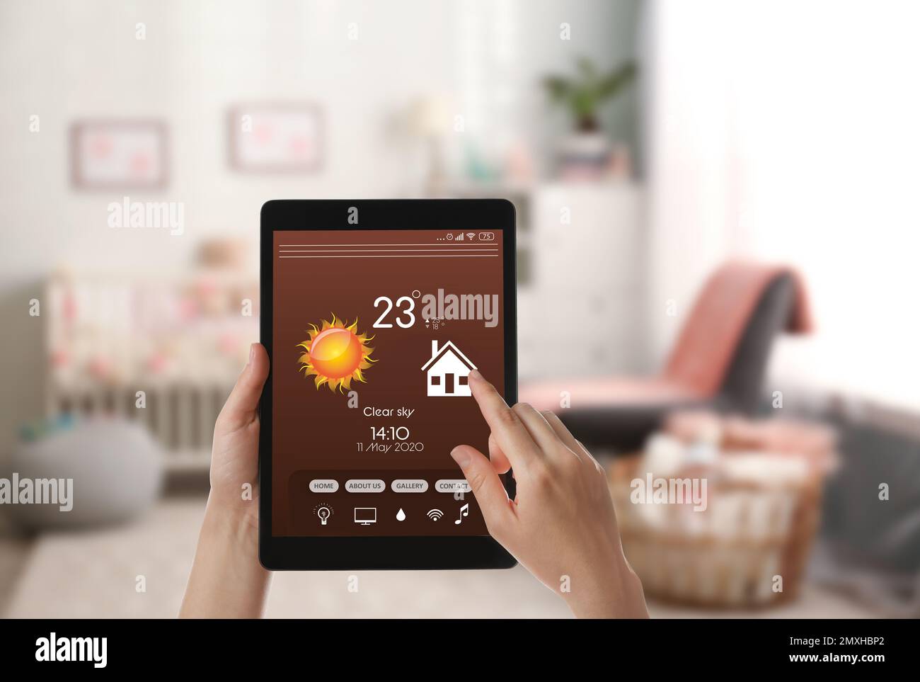 Woman using tablet to set indoor temperature, closeup. Smart home ...