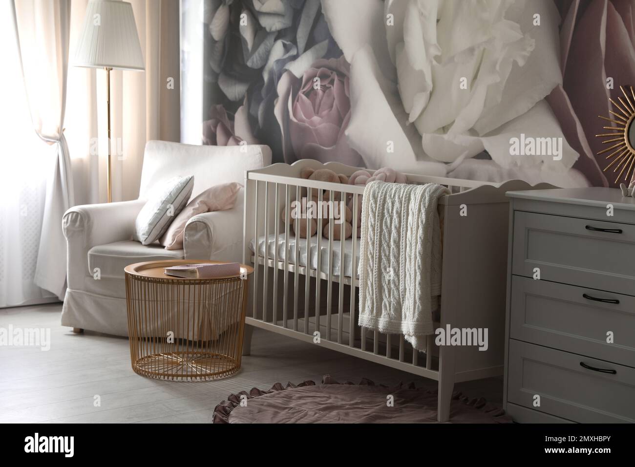 Baby room interior with stylish crib and floral wallpaper Stock Photo ...