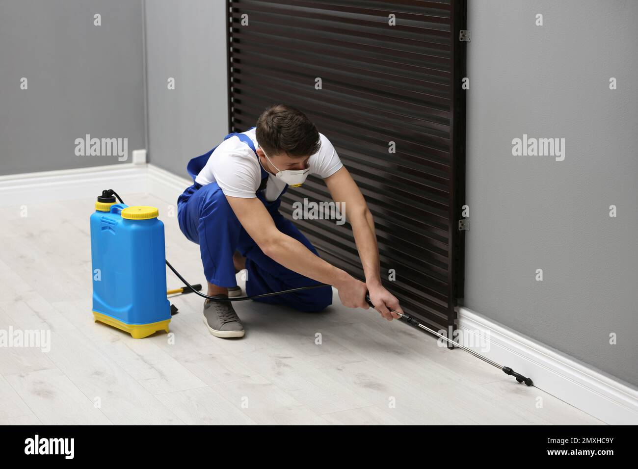 Spraying pesticide gas mask hi-res stock photography and images - Alamy