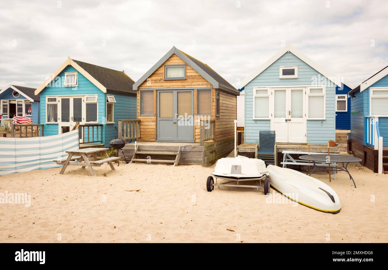 Row of wooden beach houses on a sandy beach. Hengistbury Head, Dorset, UK Stock Photo - Alamy