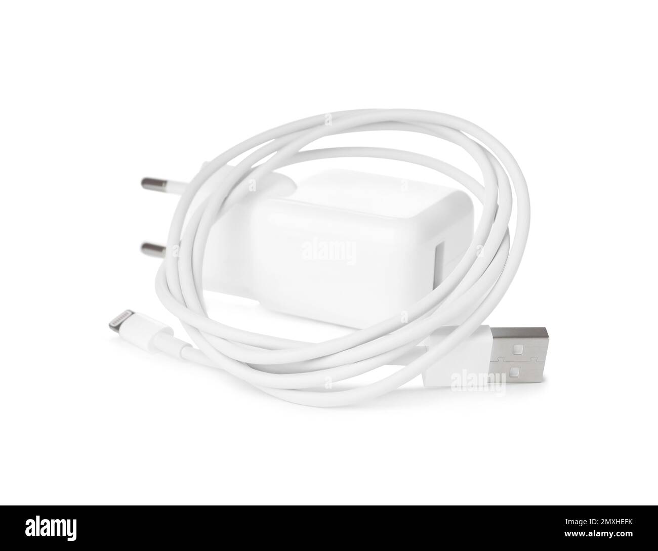 USB charge cable and power adapter on white background. Modern ...