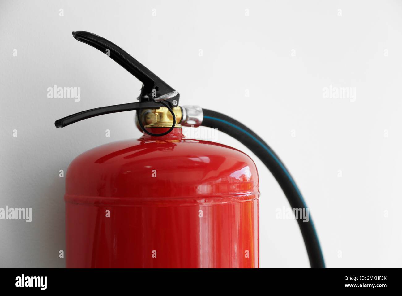 Fire extinguisher on white background, closeup view Stock Photo - Alamy