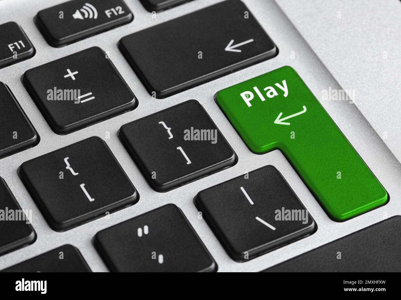 Laptop keyboard with button Play, closeup. Online games concept Stock ...
