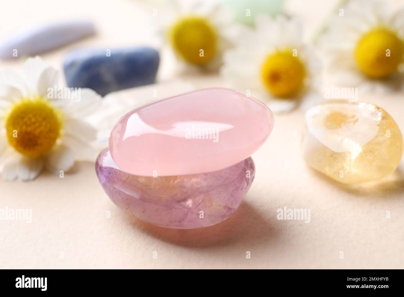Beautiful gemstones on beige table, closeup. Healing crystals Stock ...