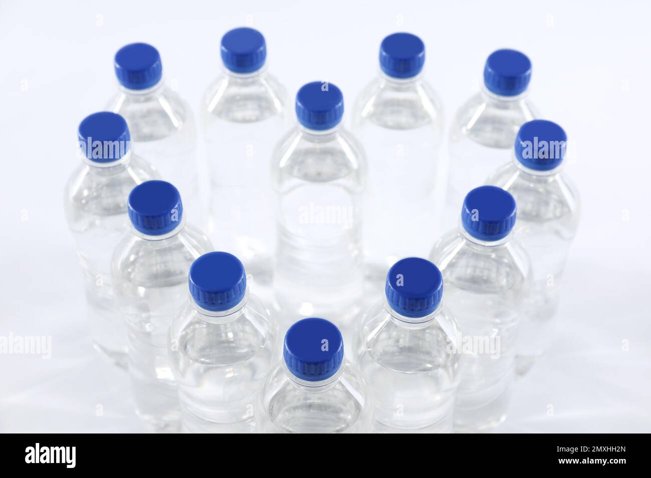 Heart made with plastic bottles of pure water on white background Stock ...
