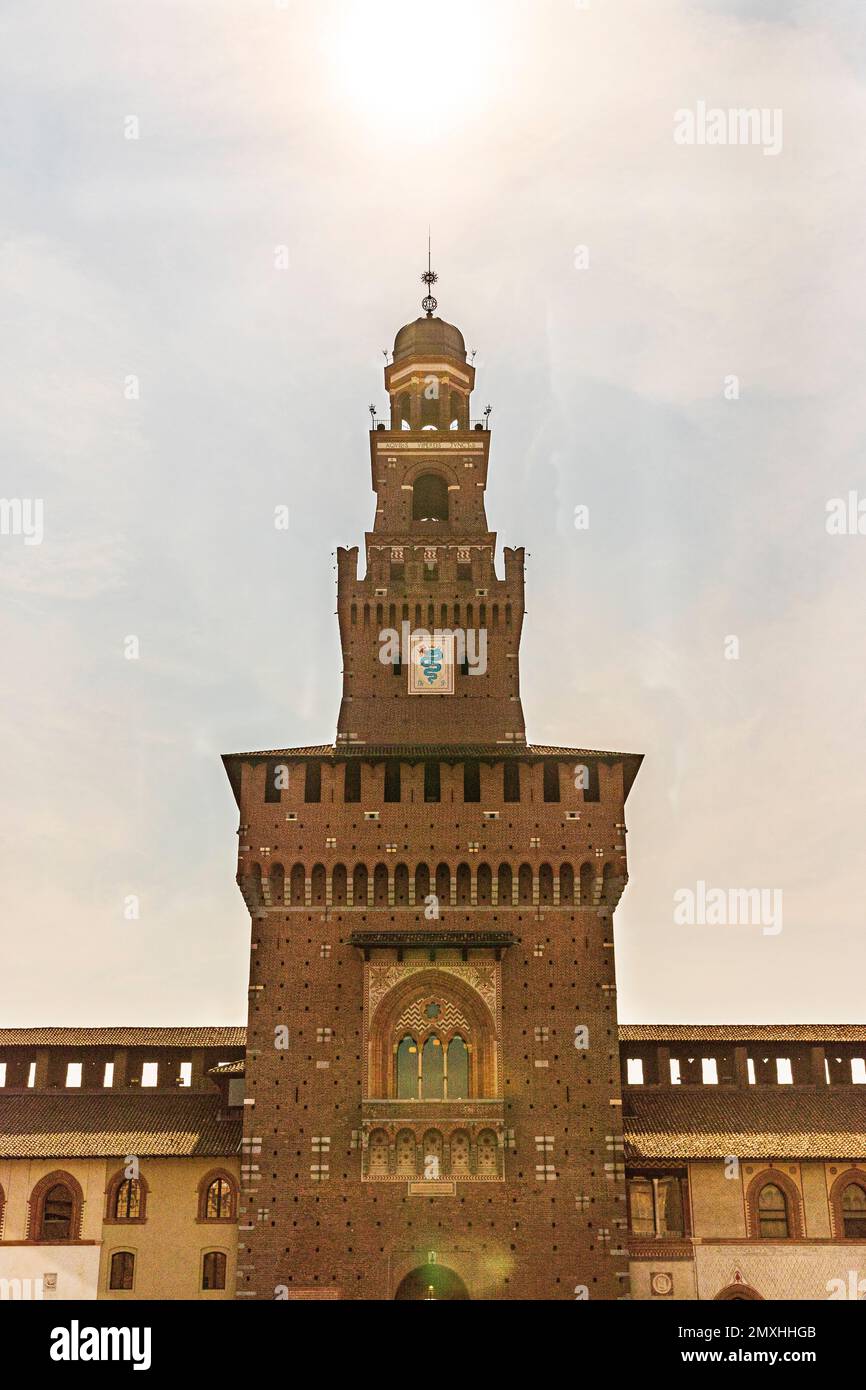 A vertical low angle shot of a historic brick tower in Milan, Italy ...