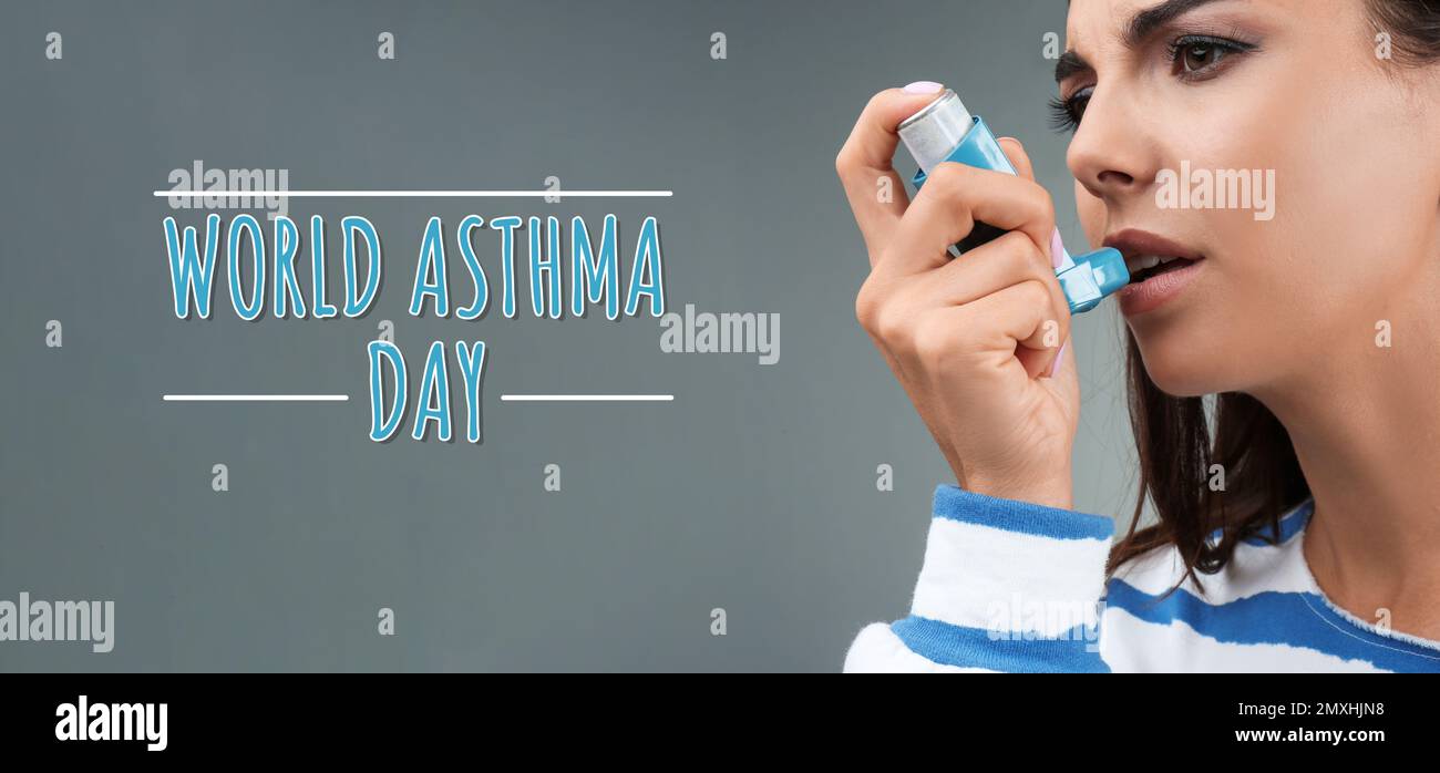 World asthma day. Young woman using inhaler on grey background, banner ...