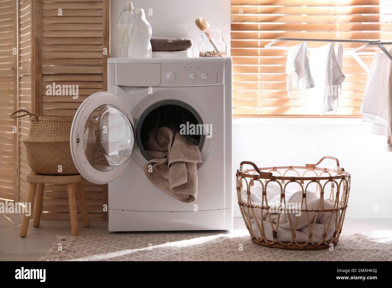 Stylish room interior with washing machine. Design idea Stock Photo - Alamy