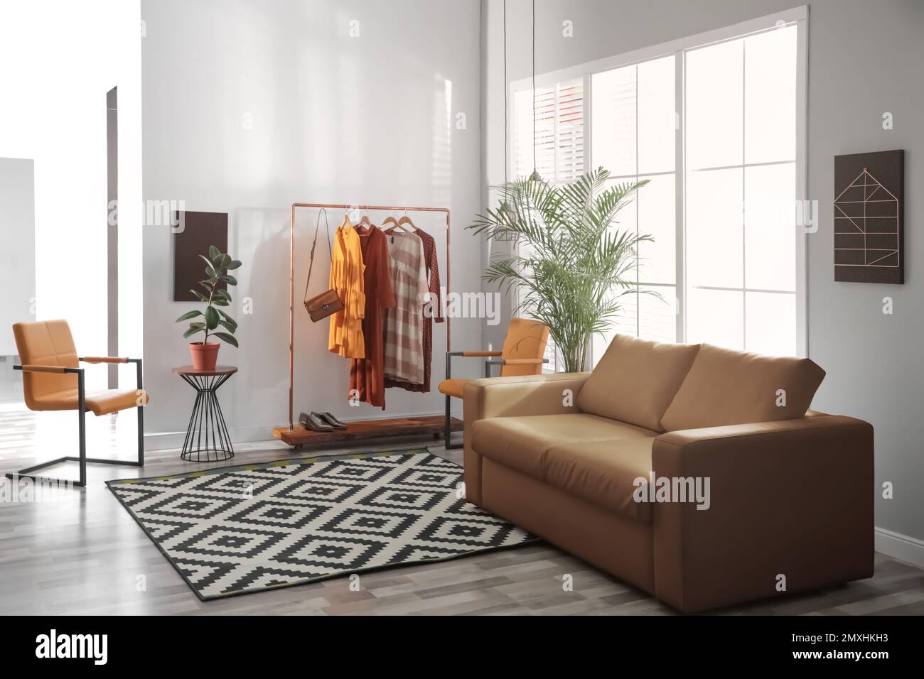 Modern living room interior with stylish leather sofa Stock Photo - Alamy