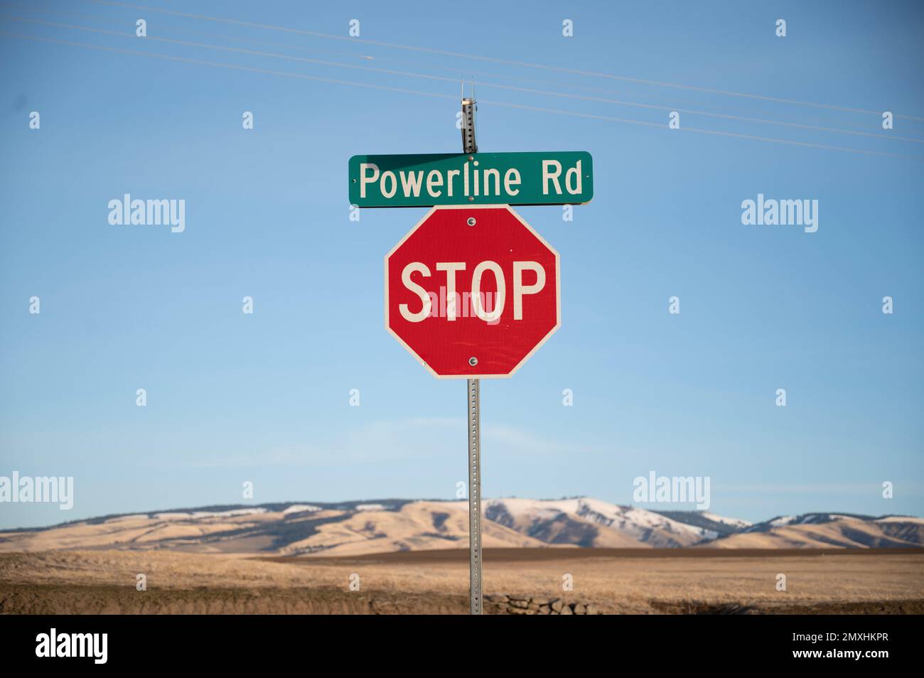 The Powerline Road with stop signal Stock Photo - Alamy