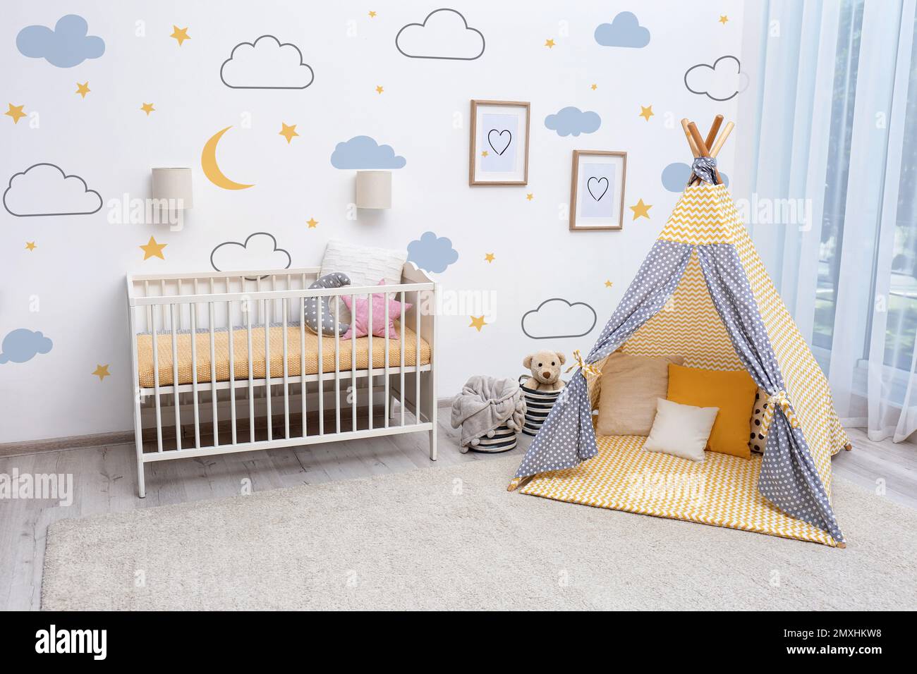 Cozy baby room interior with play tent and toys Stock Photo - Alamy