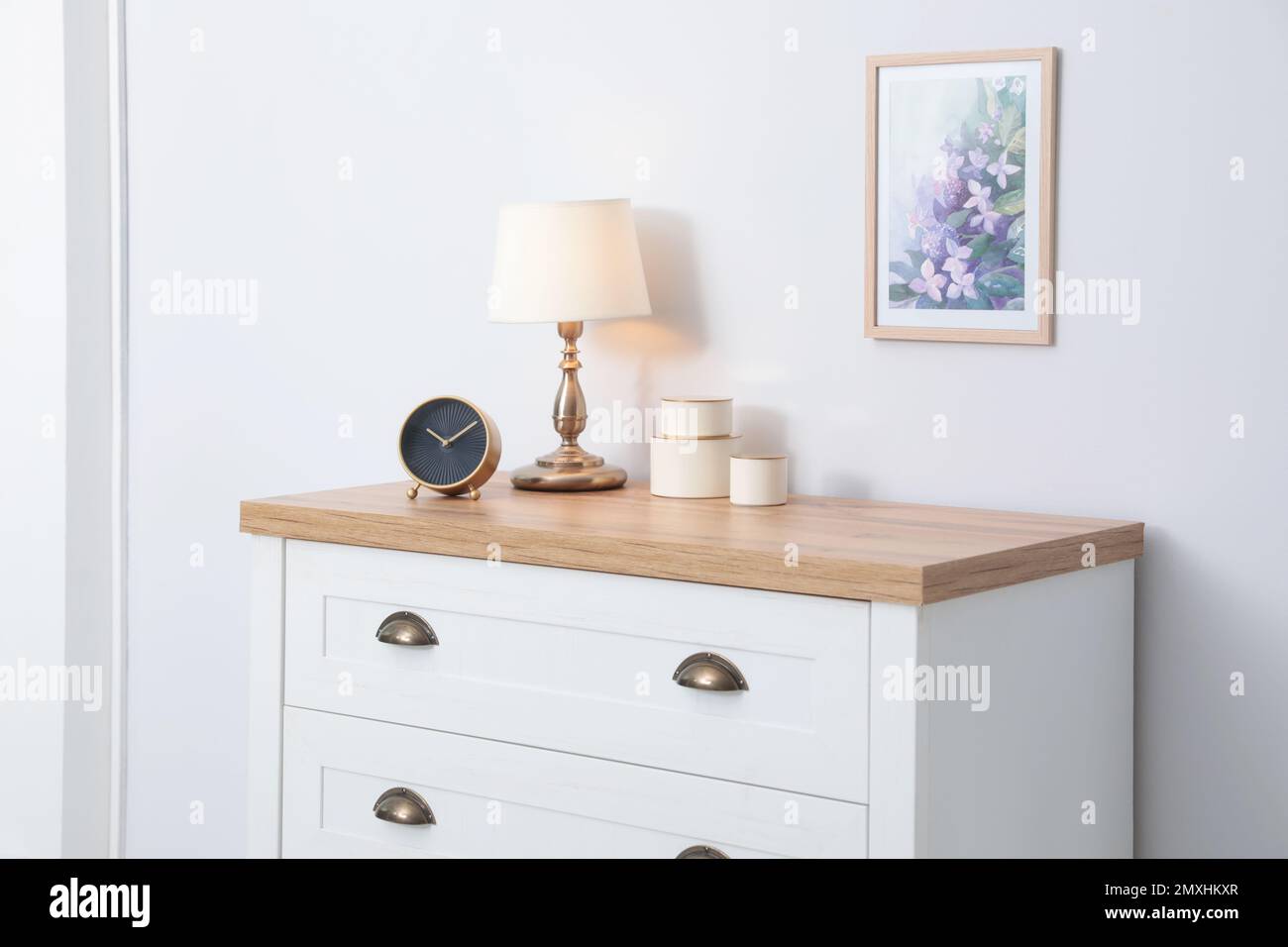 Stylish chest of drawers near light wall. Interior design Stock Photo ...