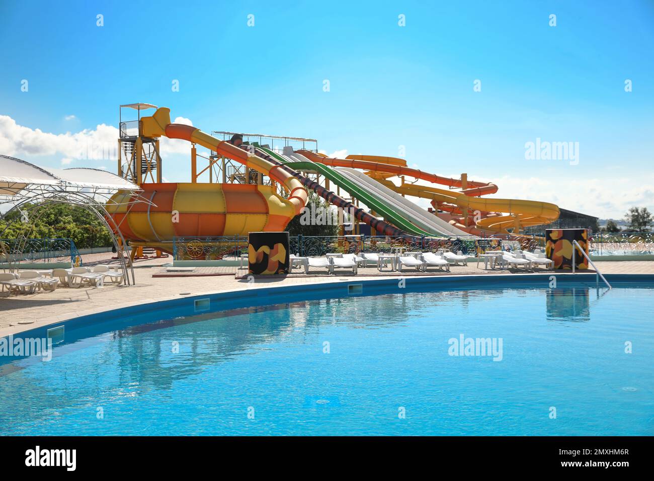 Water park with swimming pool. Summer vacation Stock Photo - Alamy