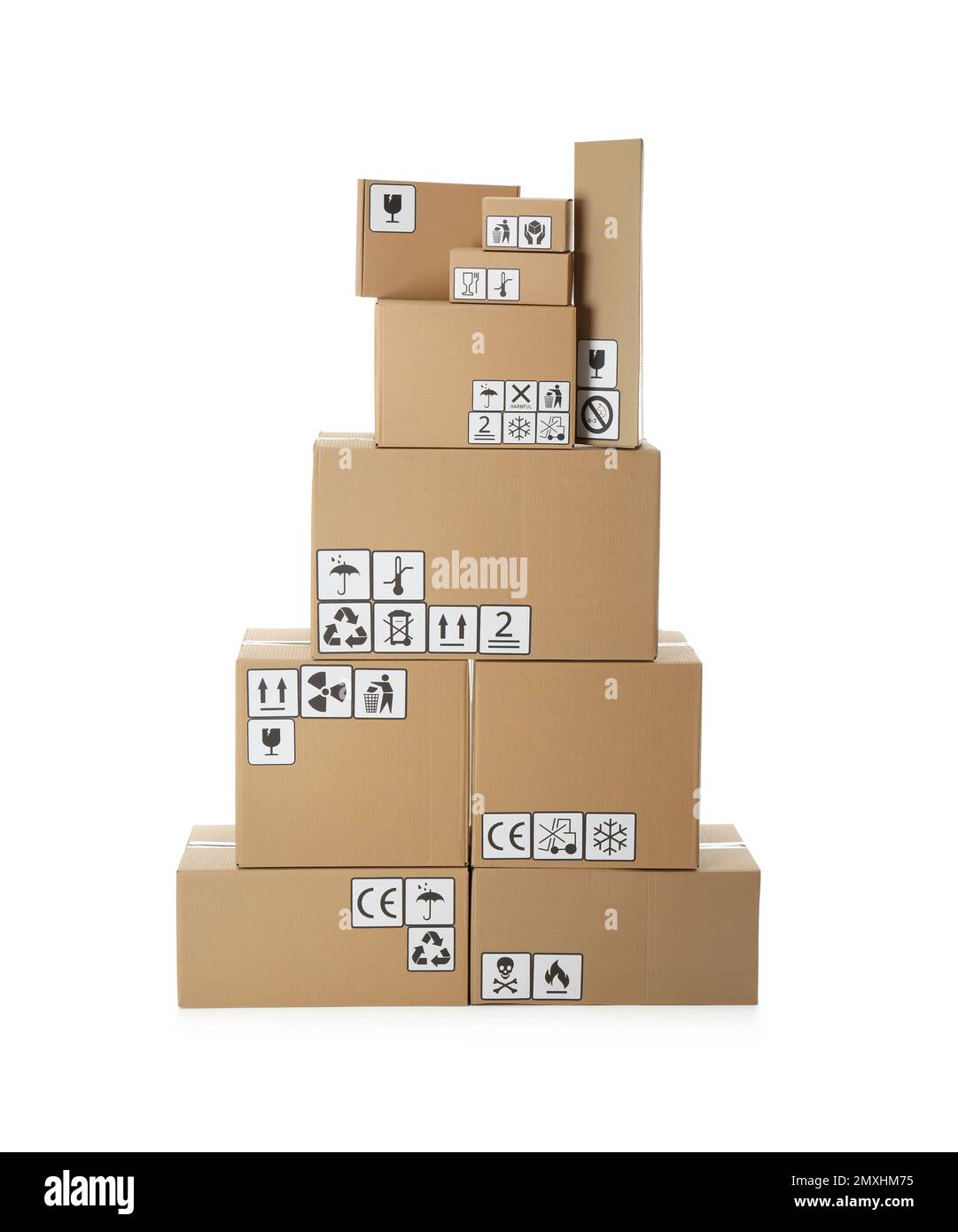 Stack of cardboard boxes with different packaging symbols on white ...