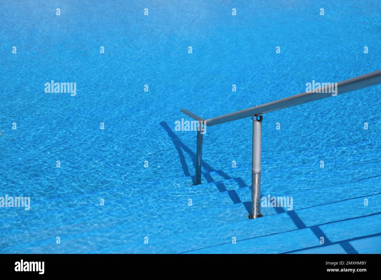 Outdoor swimming pool with clear water on sunny day. Summer vacation ...
