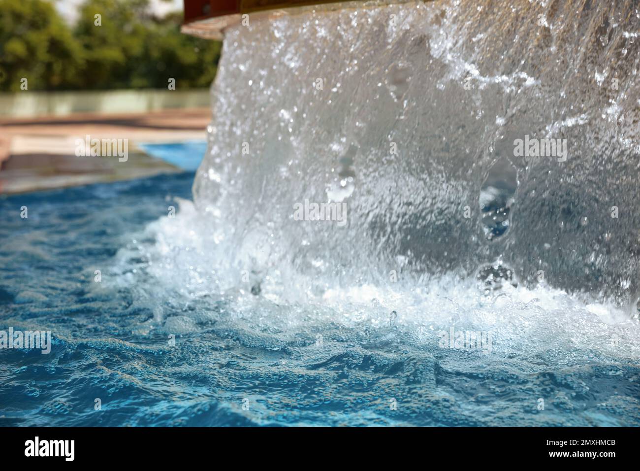 Outdoor swimming pool with clear water on sunny day. Summer vacation ...