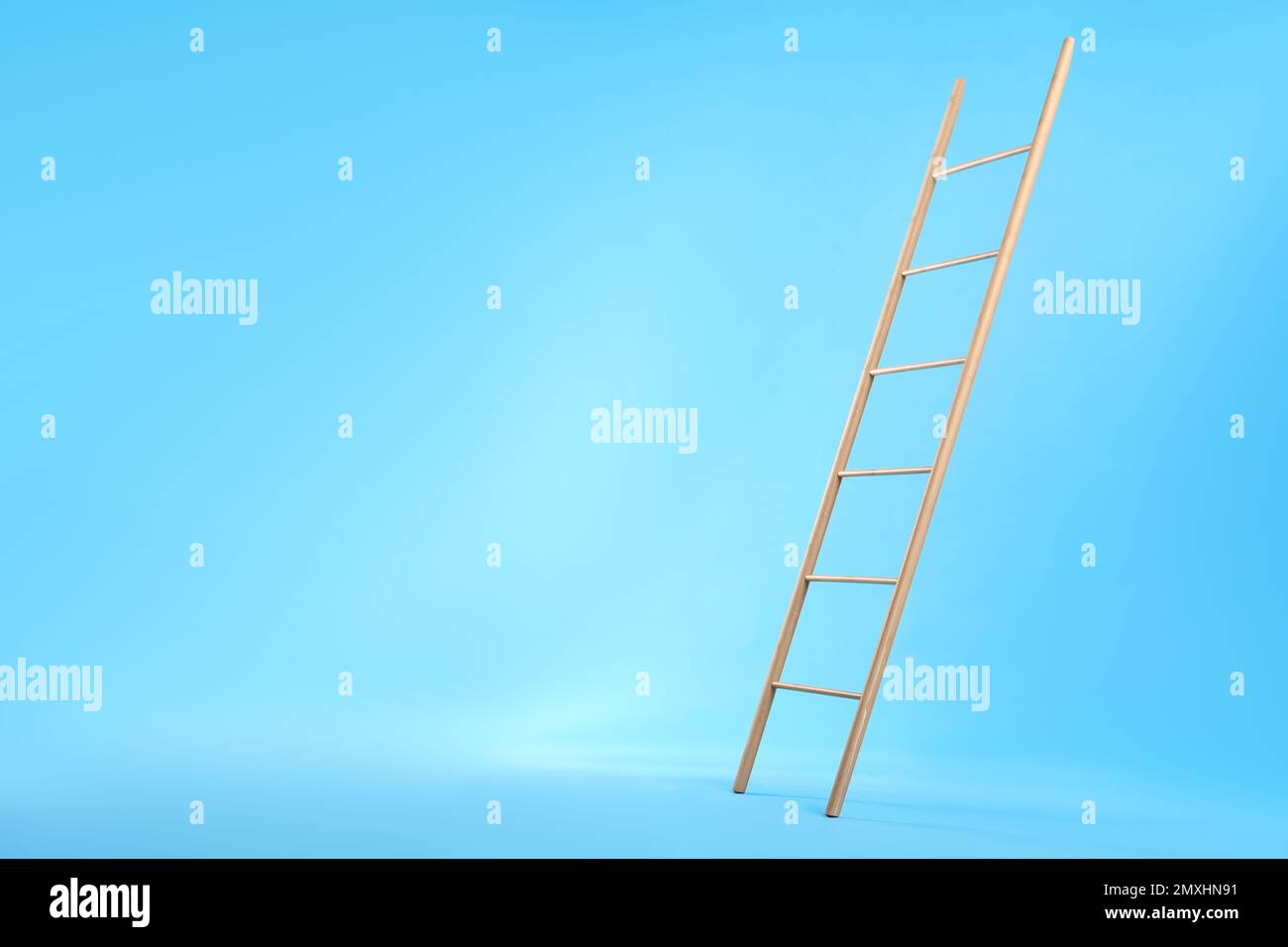 Modern wooden ladder on light blue background. Space for text Stock ...