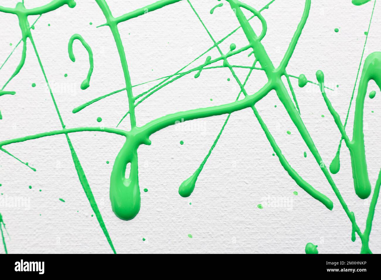 Green paint splashes on white canvas as background. Art and creativity ...